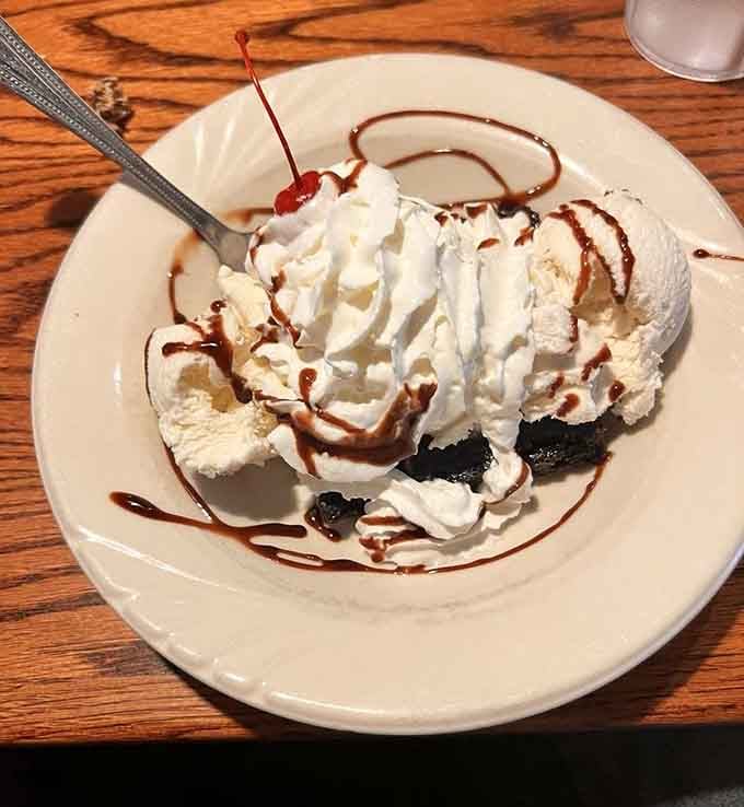 This brownie sundae buried under whipped cream is the kind of indulgence that requires no explanation whatsoever.