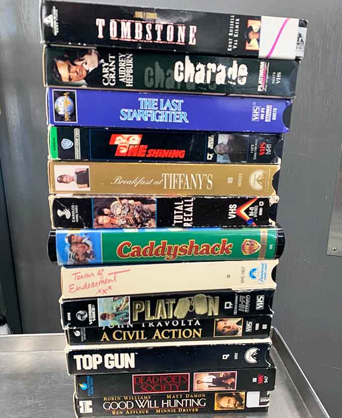 VHS tapes including Caddyshack and Top Gun, because some classics deserve their spot on your shelf.