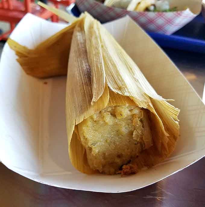 Unwrapping a tamale is like opening a delicious present, and this one doesn't disappoint the eager recipient inside.