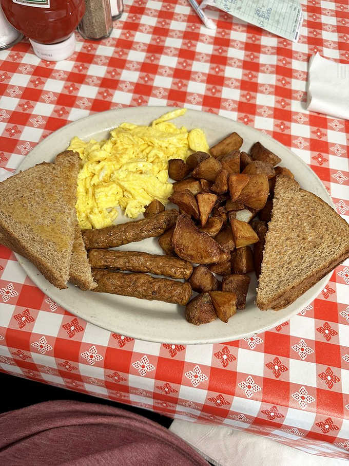 Scrambled eggs, sausage links, and toast, a classic trio that never disappoints the hungry soul.