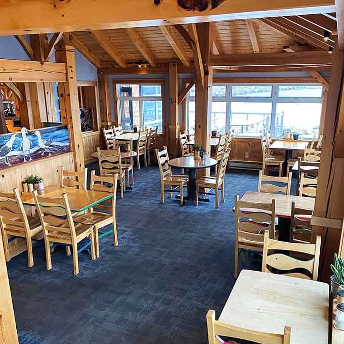 Exposed beams and simple wooden tables prove that fancy isn't necessary when you've got quality and stunning scenery working together.