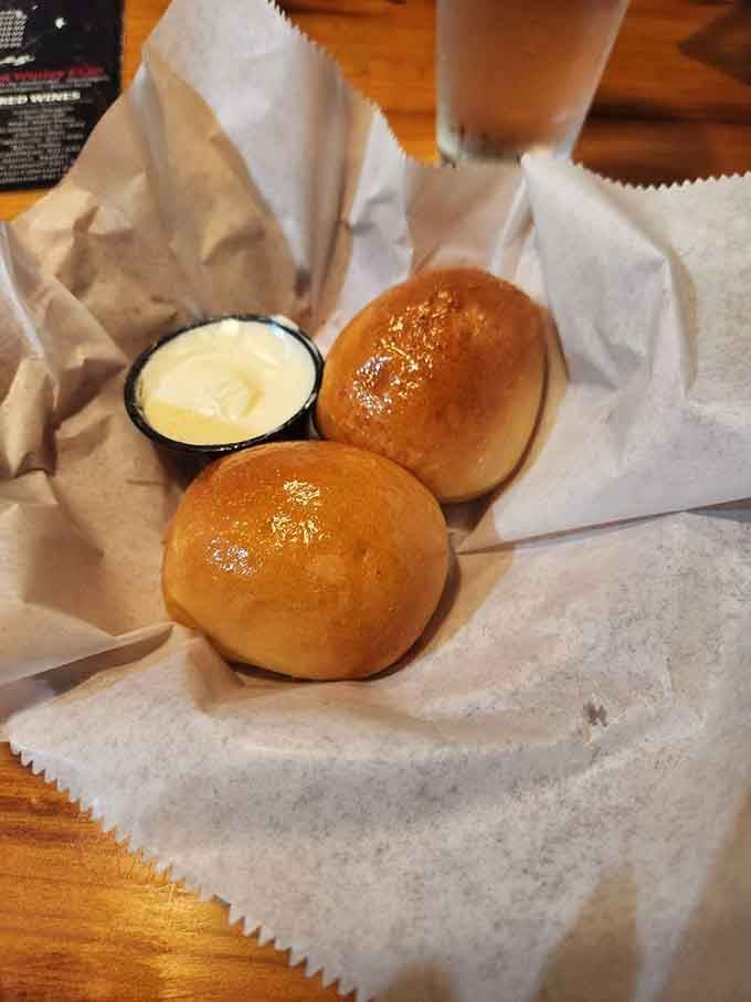 Warm buttered rolls that arrive before your meal, testing your willpower and usually winning that battle.