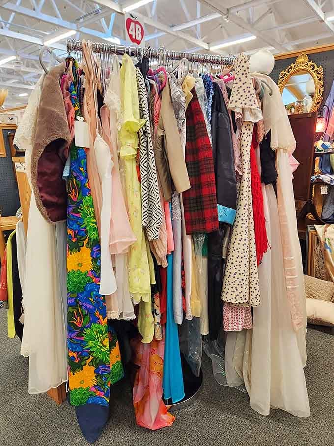 Vintage clothing hanging like a timeline of fashion, from elegant to questionable and back again.