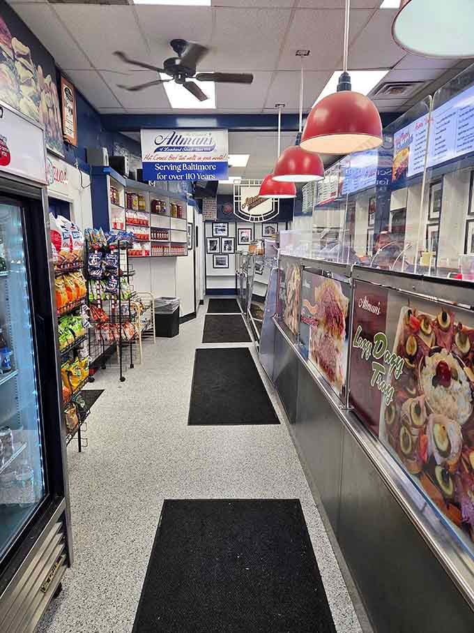 Red pendant lights illuminate the path to sandwich salvation, where decades of expertise meet your hungry soul.