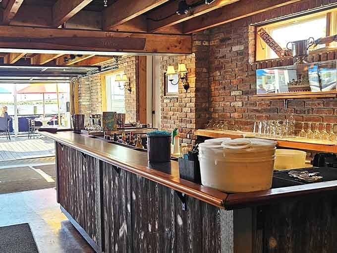 The bar area features ship wheels and maritime charm, because drinking by the water requires proper nautical ambiance and good company.