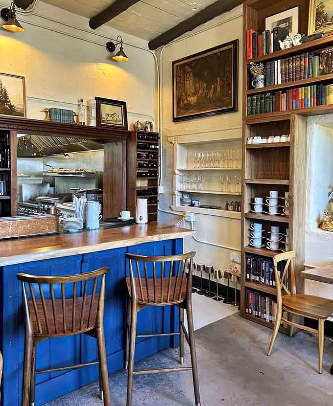 Counter seating with a view into the kitchen and shelves of books means entertainment from every possible angle.