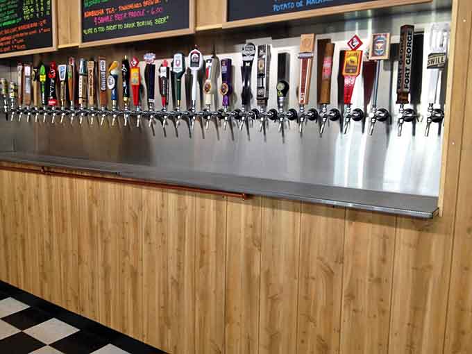 Dozens of taps line the wall like soldiers ready to serve you the perfect cold beverage.
