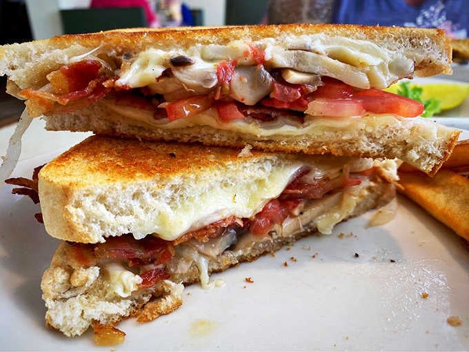 This towering grilled cheese situation with all the fixings proves that sometimes the best answer to hunger is enthusiastic excess.