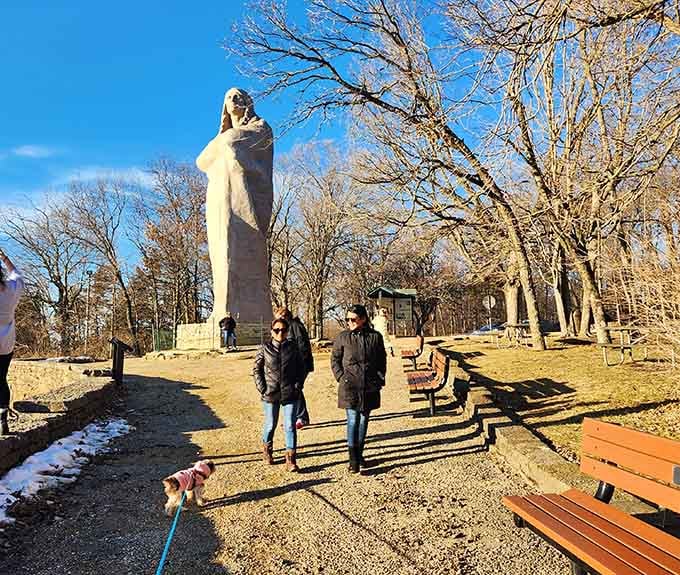 Winter visitors and their furry friends discover that this monument impresses in every season, snow or shine.