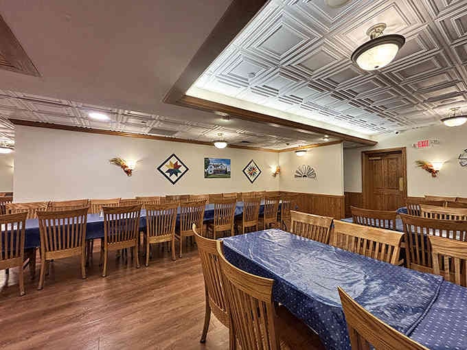 Rows of wooden chairs await hungry diners in a space that balances rustic charm with surprising sophistication.