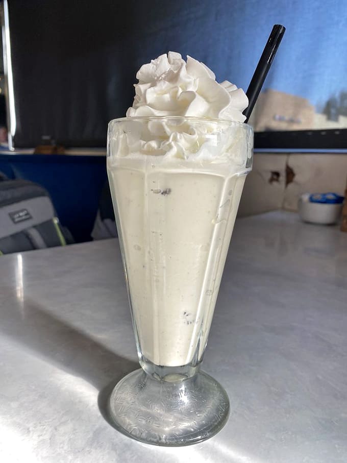 The Oreo milkshake arrives so thick your straw might stage a protest before you finish this glorious creation.