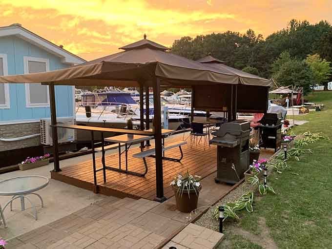 Golden hour transforms this waterside setup into pure magic, complete with grill ready for your culinary masterpiece tonight.