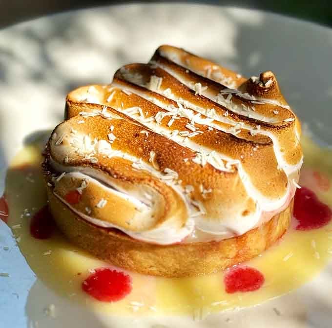 Baked Alaska with torched meringue peaks that deserve their own standing ovation and Instagram moment.