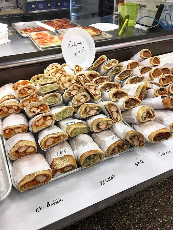 Wrapped calzones lined up like soldiers ready to march straight into your grateful, hungry hands right now.