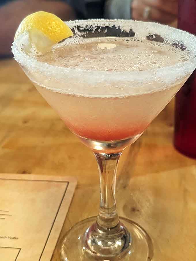 This lemon drop martini looks like liquid sunshine decided to take a vacation in a sugar-rimmed glass.