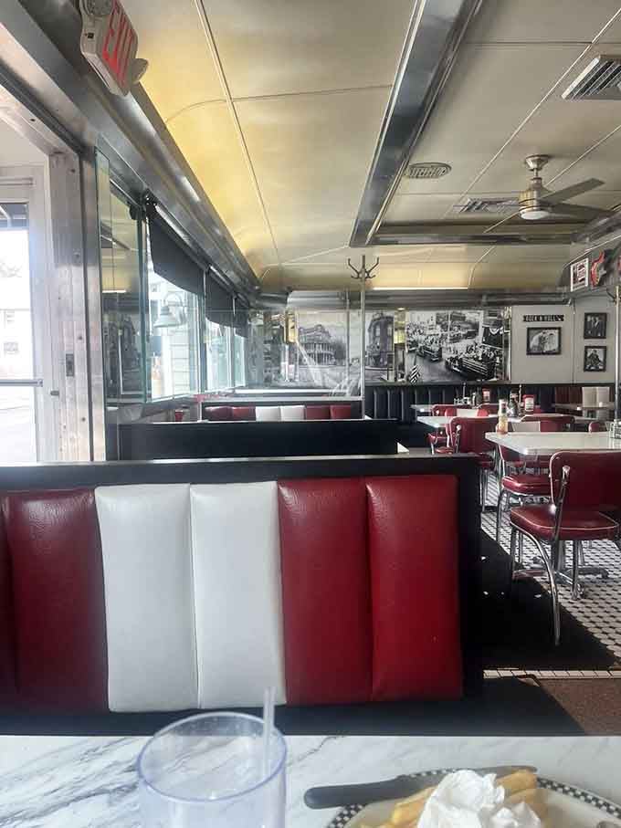 Red and white booths line this authentic train car where breakfast dreams come true every single day.