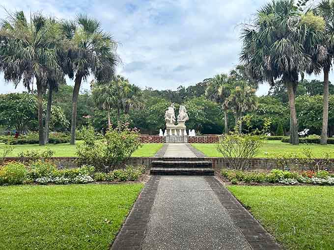 Palm trees frame this sculpture garden view like nature's own picture frame, perfectly composed and waiting.