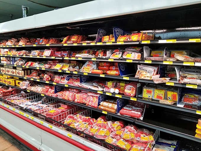 Packaged meats and sausages fill the cooler, representing flavors from continents your passport has never even visited yet.