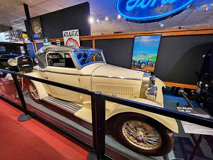 Cream-colored elegance meets open-air adventure in this stunning Bugatti that screams Jazz Age sophistication and speed.