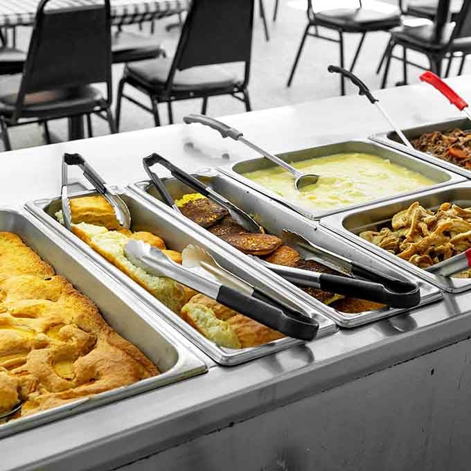 The buffet stretches out like a delicious promise, each tray holding another reason to loosen your belt.