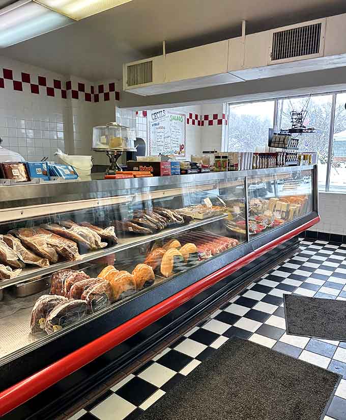 The bakery counter displays fresh breads and pastries behind glass, tempting you to add just one more thing to your already ambitious order.