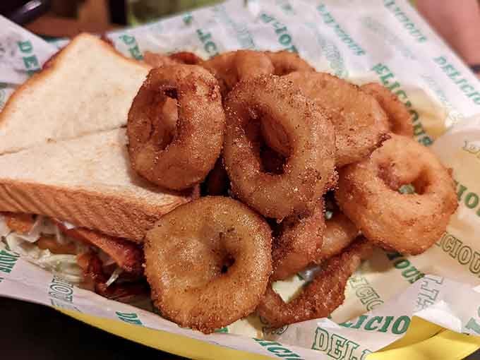 Golden onion rings so perfectly crispy they could double as edible jewelry for your burger-loving soul.