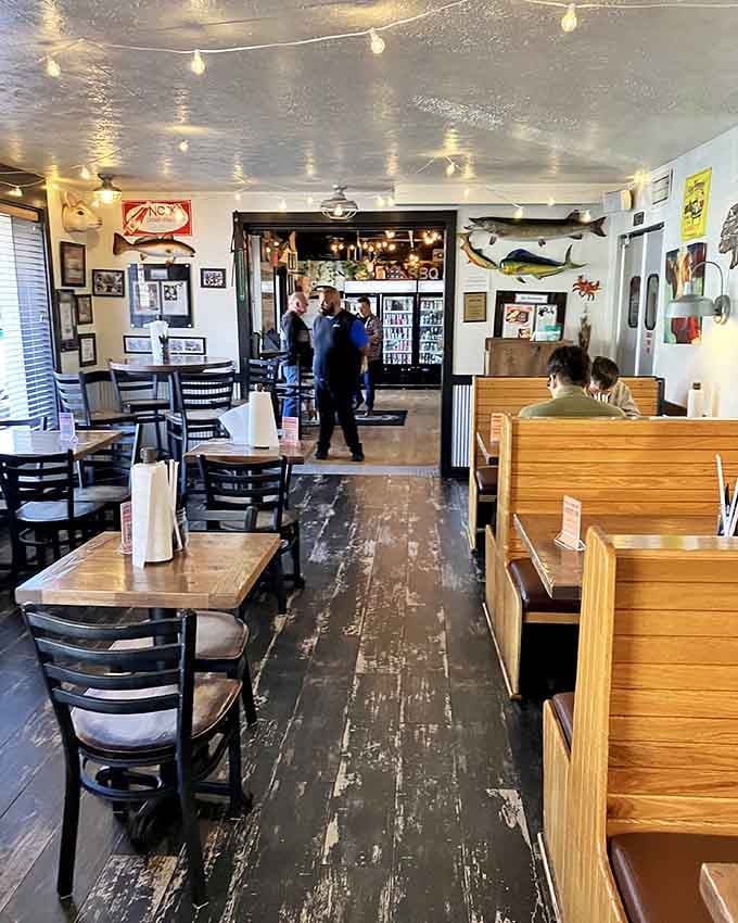Fish mounts decorate the walls, creating a casual atmosphere where everyone feels right at home immediately.