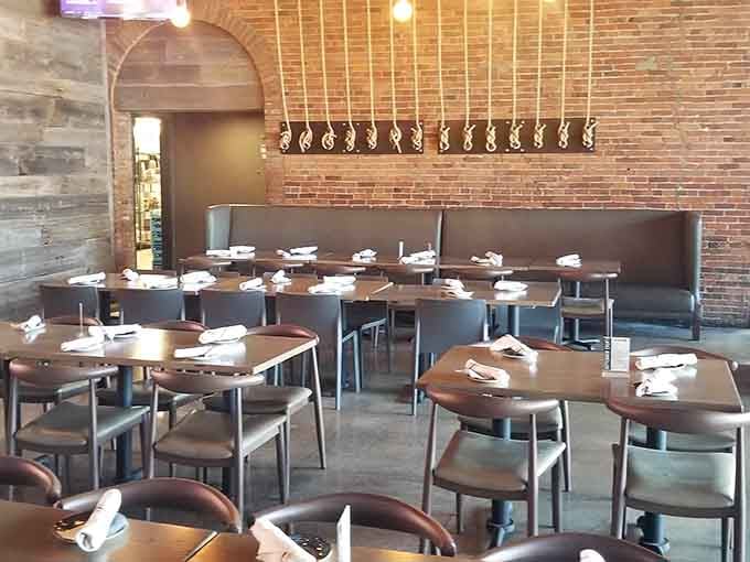 The dining room's warm lighting and exposed brick create an atmosphere that makes lingering over another beer feel absolutely mandatory.