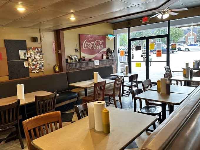 Checkered floors and booth seating where countless napkins have sacrificed themselves in the noble pursuit of barbecue happiness.