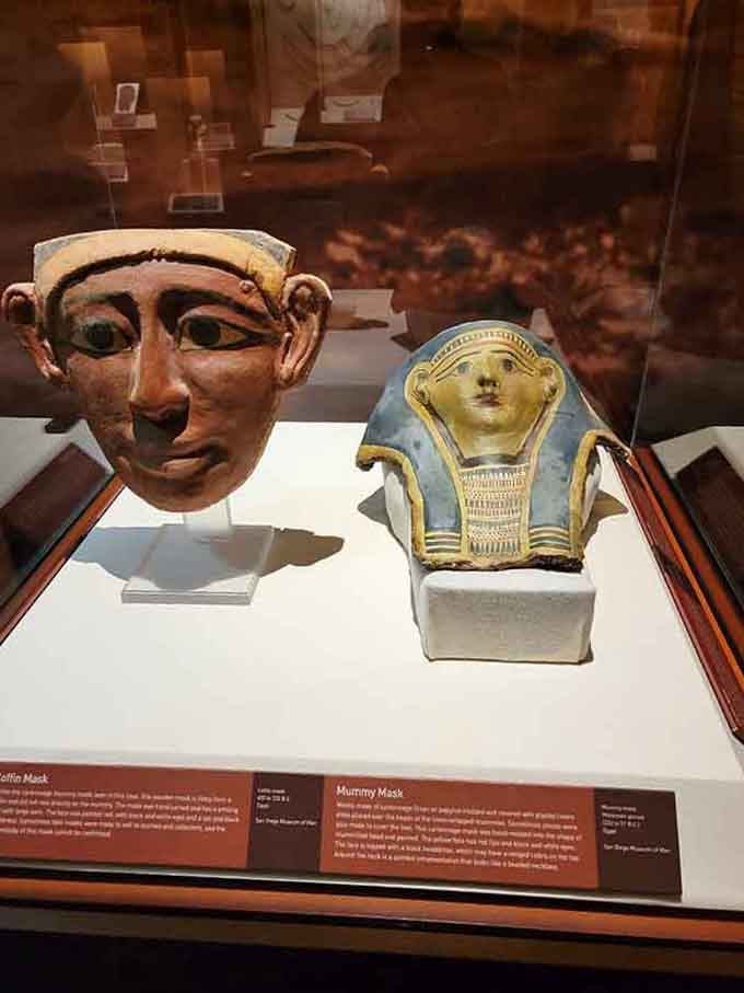 Ancient Egyptian masks staring through millennia, silently judging your modern life choices with eternal patience and wisdom.