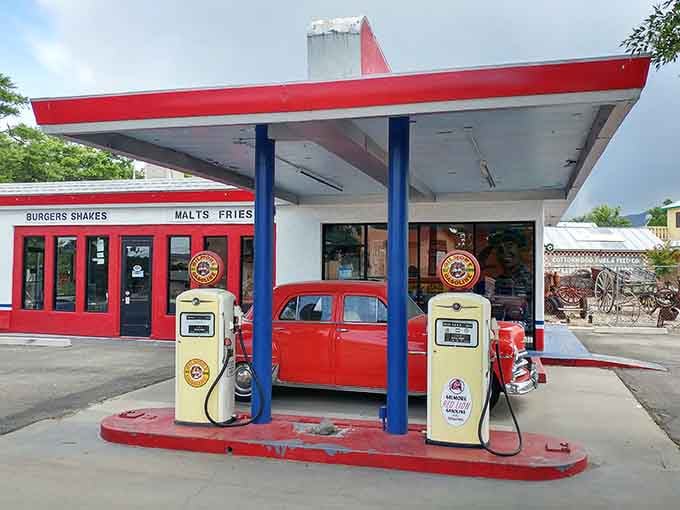 Vintage gas pumps and classic cars create an Instagram-worthy scene that's pure Americana with a side of nostalgia.