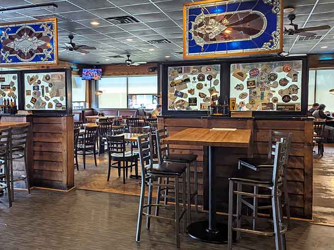 High-top seating with stained glass accents and enough beer taps to make any barbecue lover feel right at home.