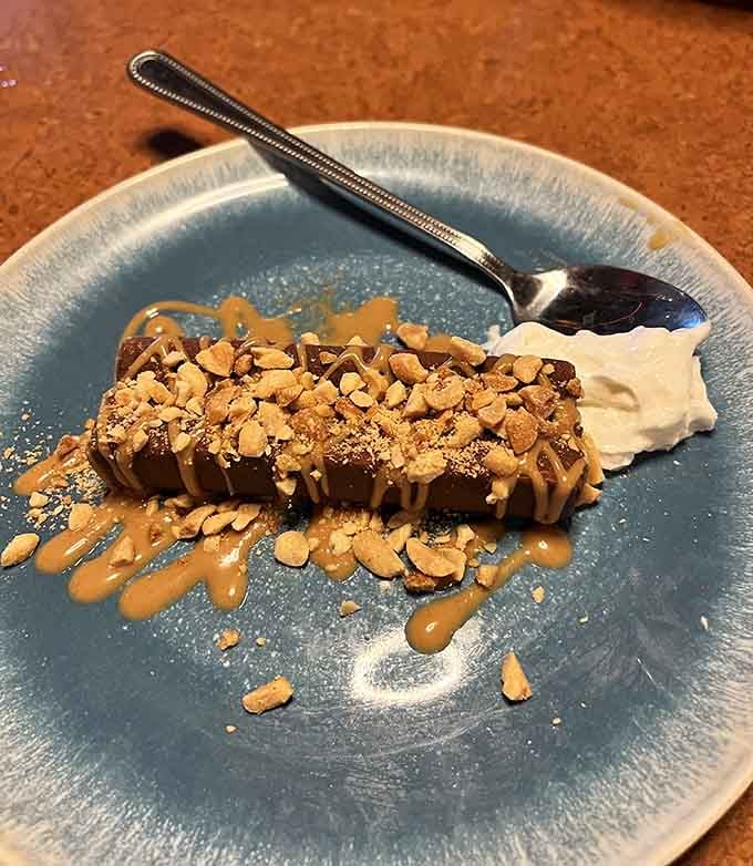 This dessert arrives looking like it raided a candy store and has zero regrets about it.