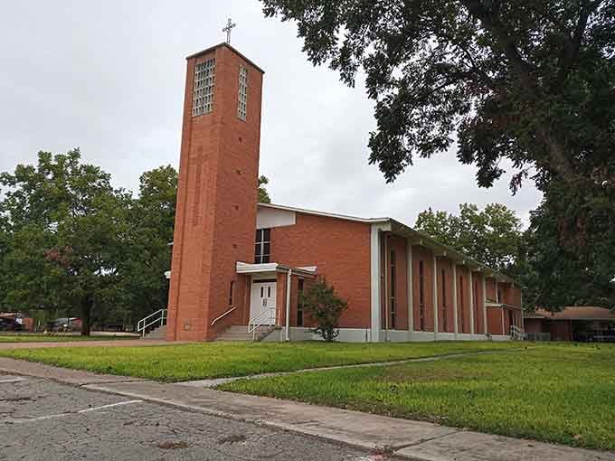 Holy Cross Church's distinctive tower reaches skyward, a mid-century architectural statement that refuses to whisper when it speaks.