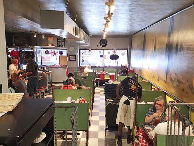 Bright green booths provide the perfect backdrop for serious breakfast conversations and syrup-related emergencies.