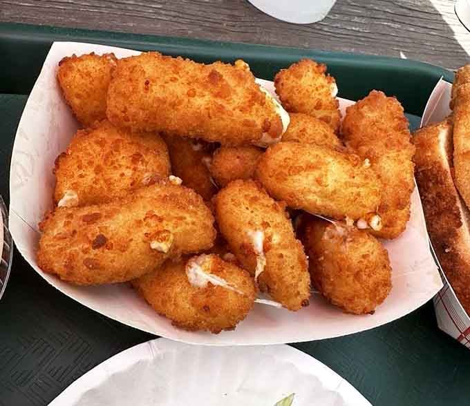 Golden fried cheese curds proving that Wisconsin doesn't have a monopoly on dairy-based happiness after all.