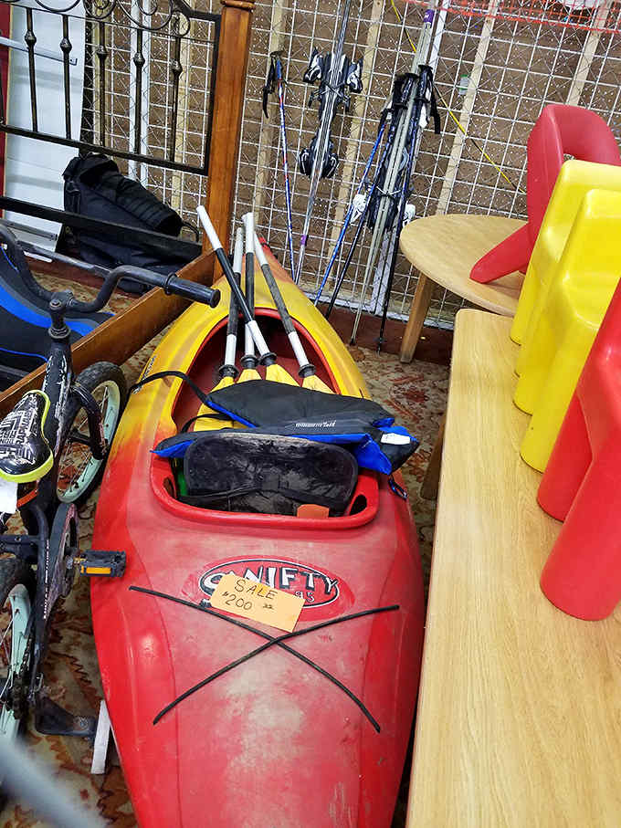 A bright red kayak promises summer adventures at a fraction of what sporting goods stores charge for the same thrills.