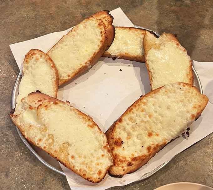 Six pieces of garlic-buttered heaven arranged like edible treasure waiting to disappear in minutes flat.