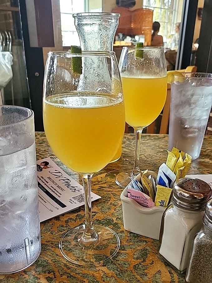 Mimosas served in proper glassware because even casual lunch deserves a touch of civilized day drinking elegance.