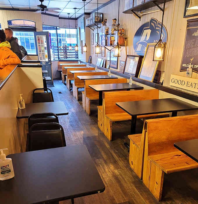 Clean lines, wooden booths, and pendant lighting create the perfect backdrop for serious sandwich eating.