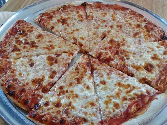 Classic cheese pizza with that perfect golden crust proves you don't need fancy toppings when you nail the fundamentals.