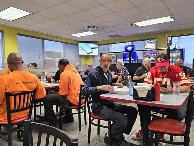 Red chairs and historical wall displays creating an atmosphere that celebrates both food and local heritage.