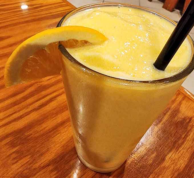 Orange creamsicle drink that tastes like childhood summers, except now you're old enough to appreciate it with seafood on the side.