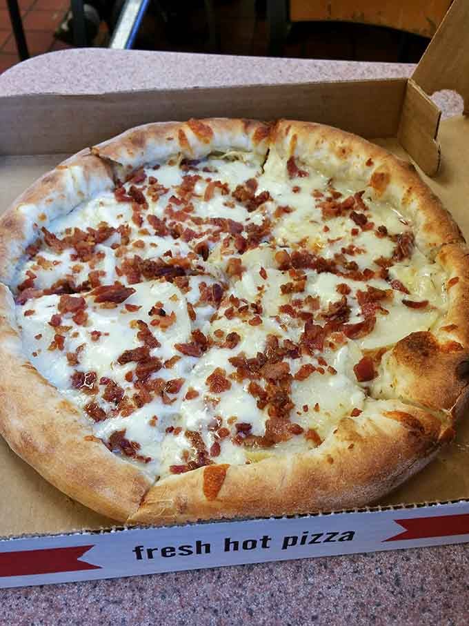 Pizza topped with bacon because sometimes you need to combine all your favorite food groups at once.