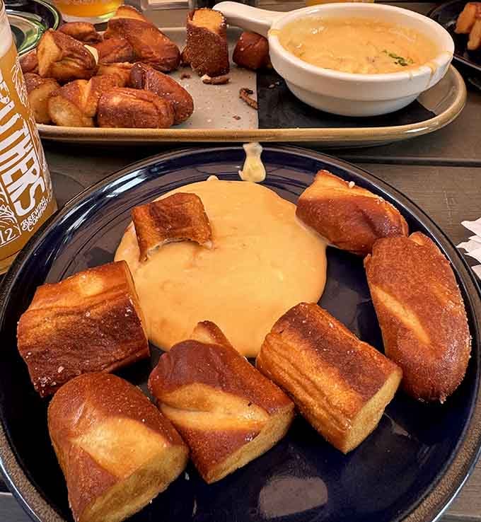 Pretzel bites surrounding beer cheese like they're protecting their creamy, delicious leader from invading taste buds everywhere.