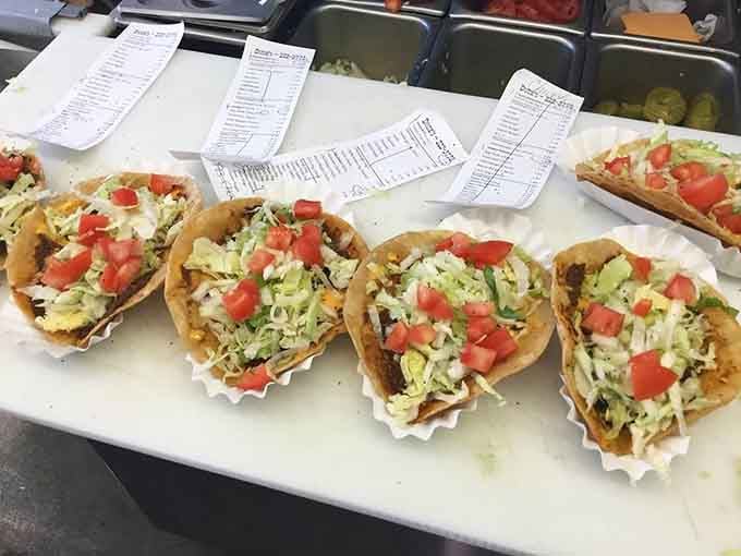 Tacos lined up like little edible soldiers, ready to march straight into your heart and stomach simultaneously.