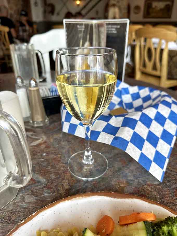 White wine and fresh vegetables, because even at a German restaurant, balance is important before the schnitzel arrives.