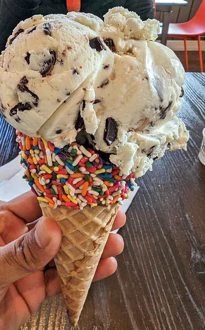 Cookies and cream collide in this towering creation, complete with colorful sprinkles that would make any kid from any generation smile wide.