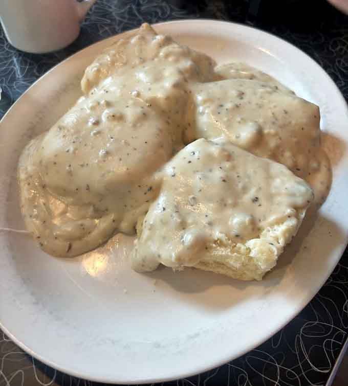 Biscuits drowning in sausage gravy, the kind of comfort food that makes you understand why people write songs.