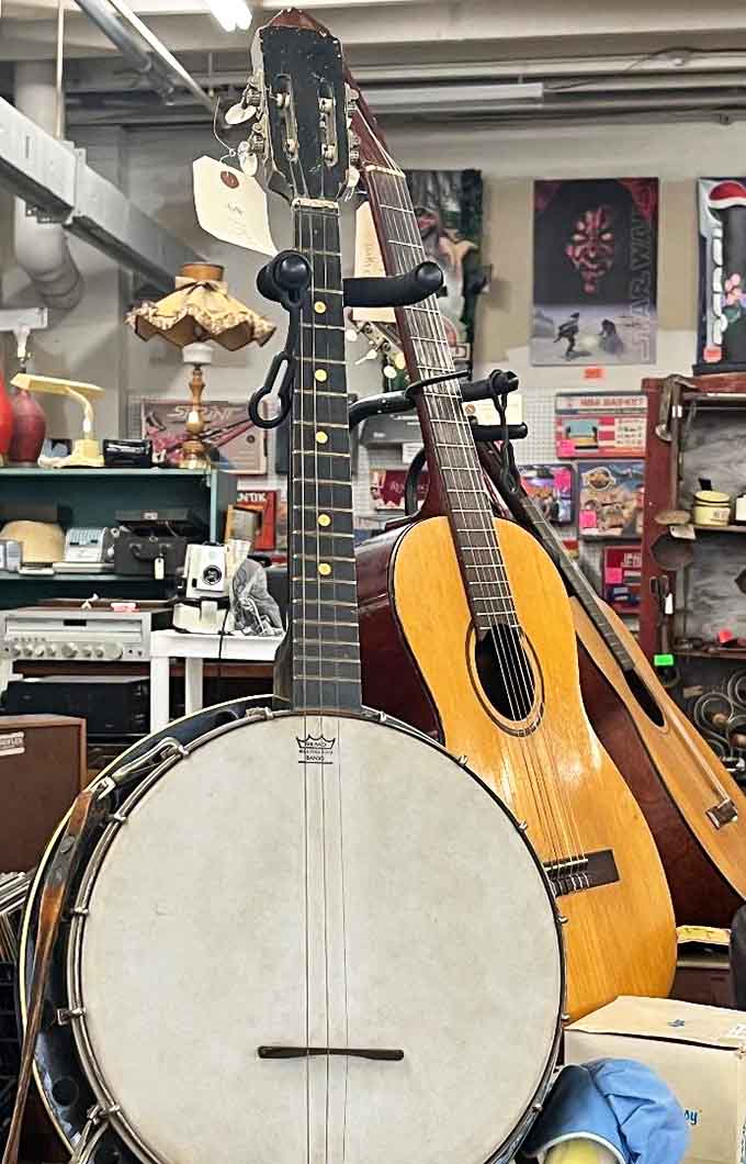 Musical instruments waiting for their next performance, from banjos to guitars, each with its own melodic history.